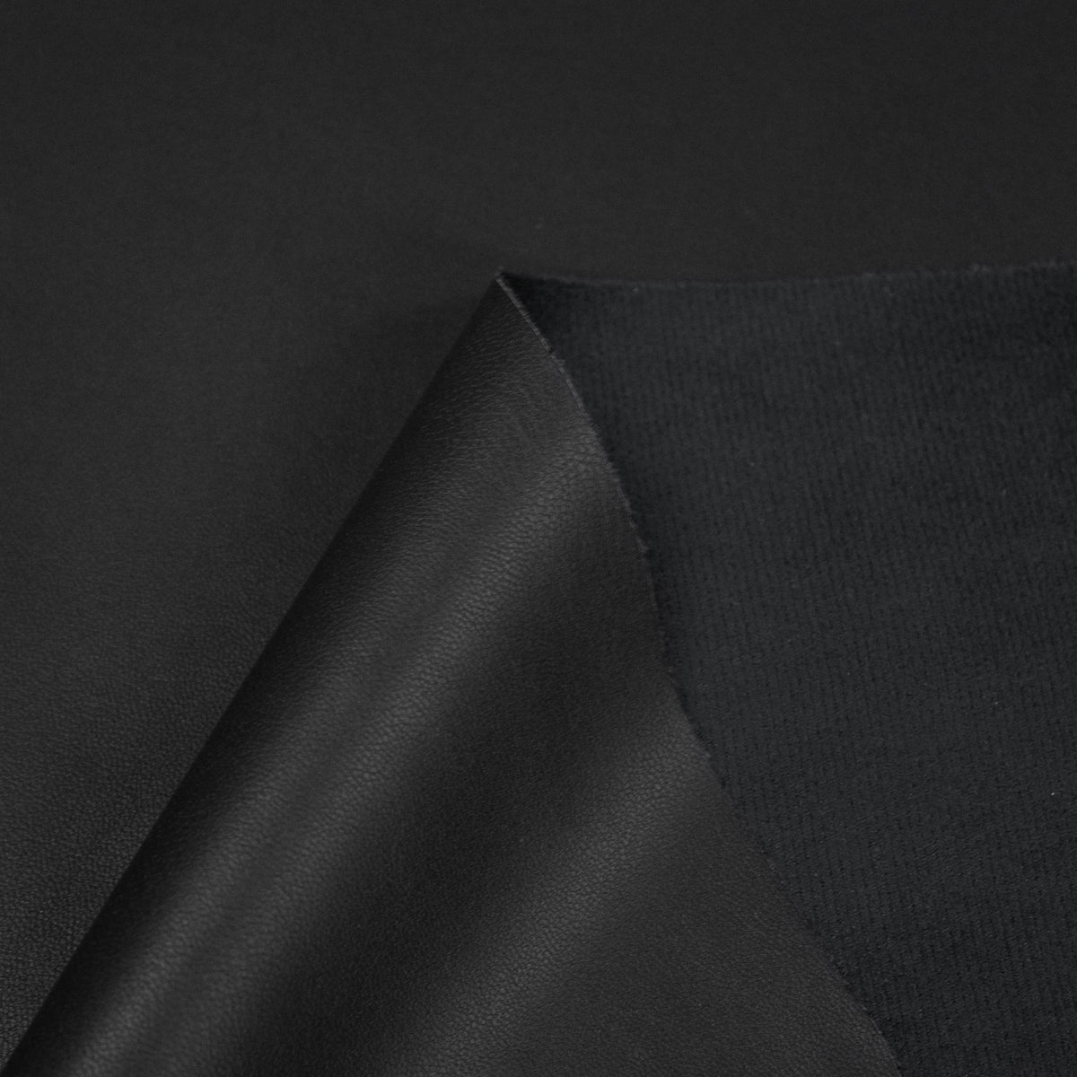 Lean Black Polyamide Faux Leather Stretch Fabric | THE FABRIC SALES