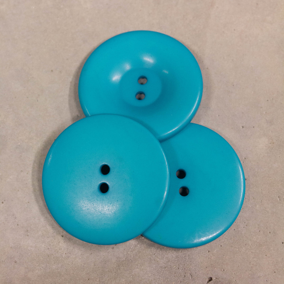 Turquoise Blue Plastic 2-Hole Button 40mm | THE FABRIC SALES
